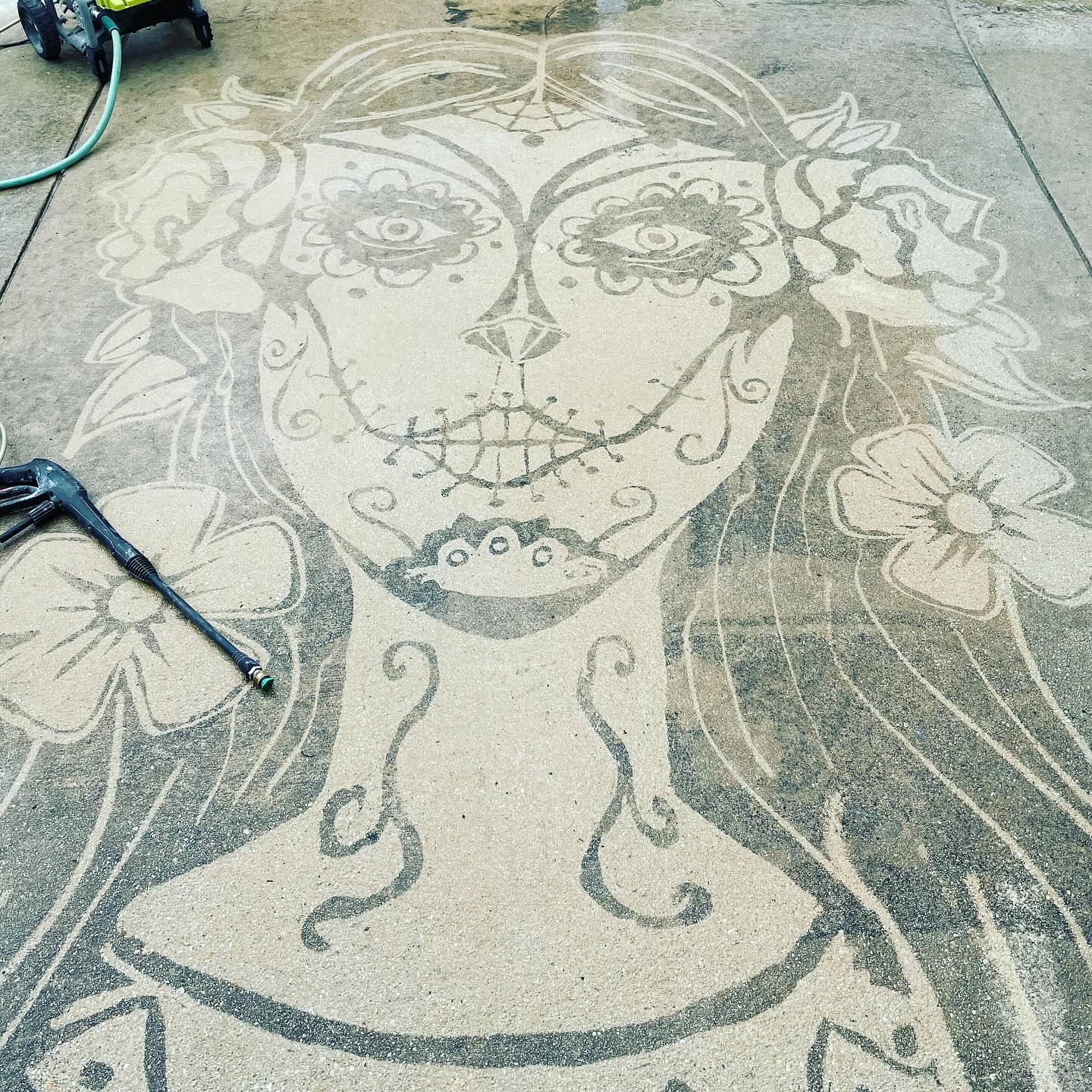 Man Uses Pressure Washer to Create Art on Pavement - PlayJunkie